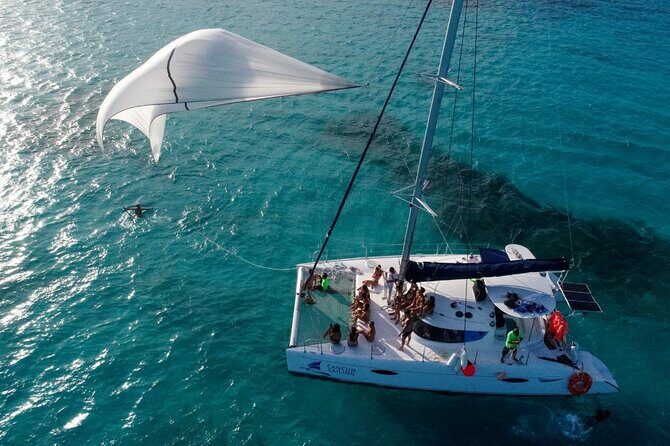 Catamaran Tour to Isla Mujeres, Open bar, Lunch, Snorkeling, Beach Club Included - Authentic Insights from Reviews