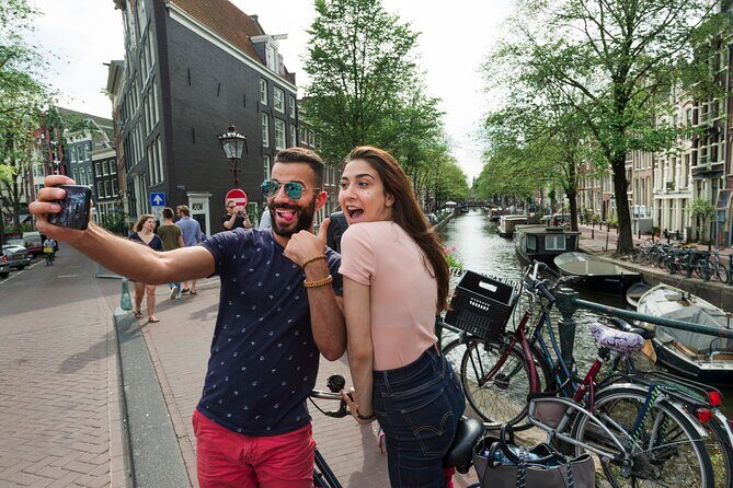 Amsterdam Highlights Bike Tour - Guided in EN/ES/DE/NL - Transportation, Group Size, and Value