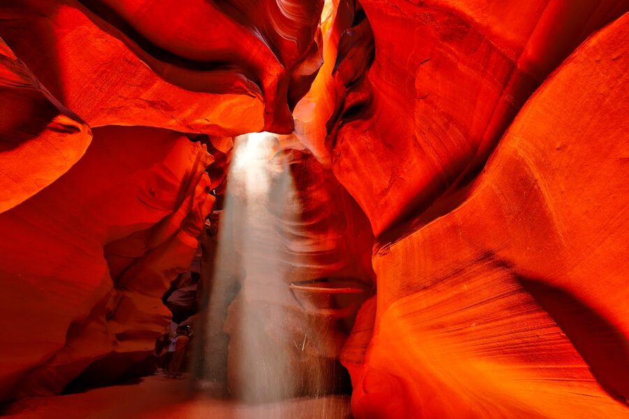 Dramatic sunlight beams illuminating the red walls of Antelope Canyon Arizona