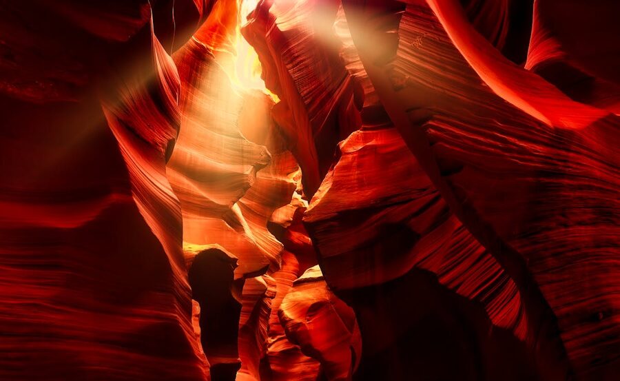 Sunlit swirling sandstone formations inside Antelope Canyon