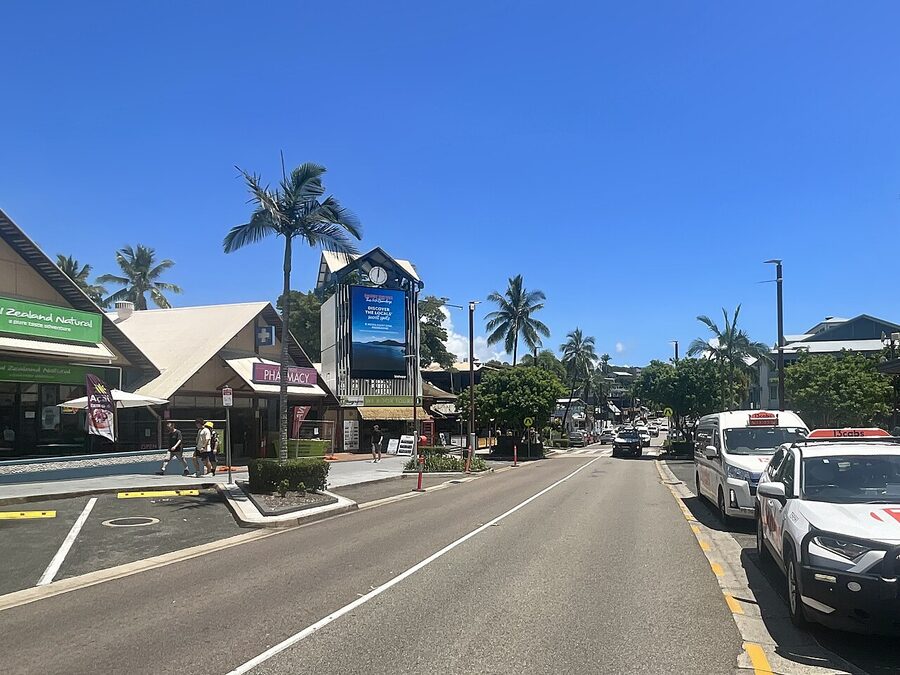 Airlie Beach main street with shops and tour kiosks