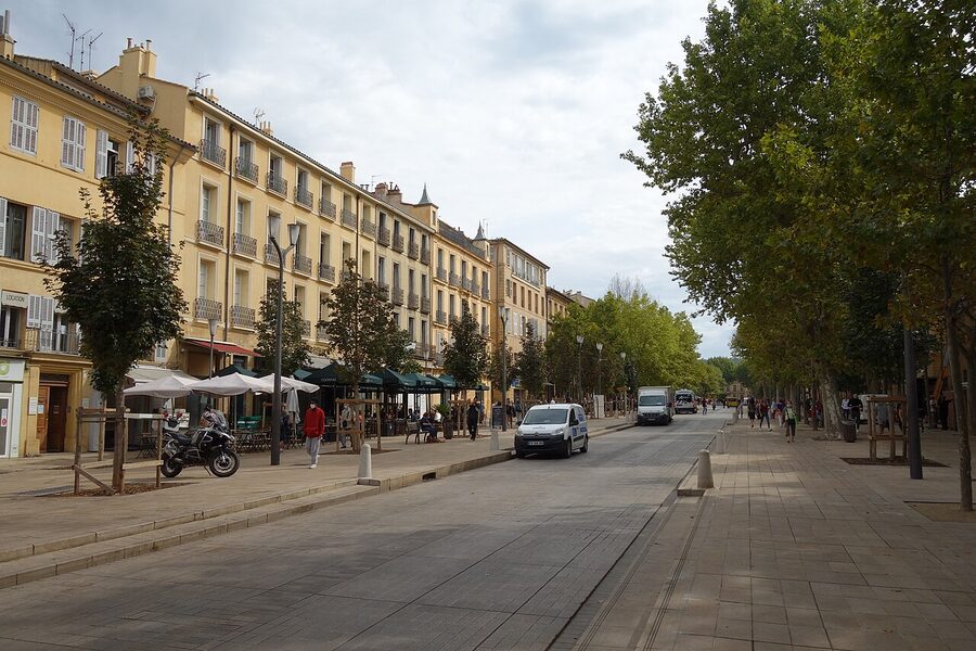 Tree-lined cours Mirabeau seen at street level in Aix-en-Provence