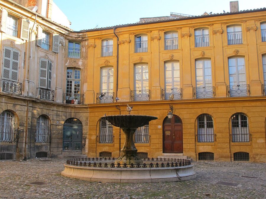 Place d'Albertas square in Aix-en-Provence with cobblestones and central fountain