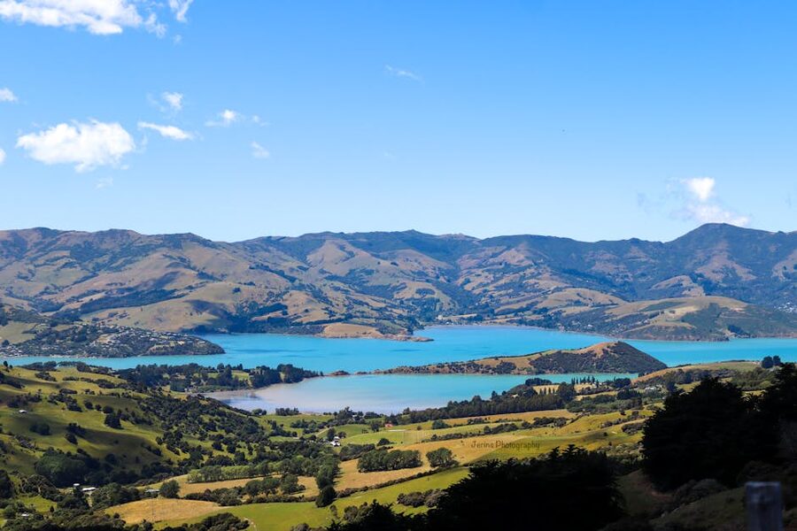 Aerial view of Akaroa Harbor with green hills