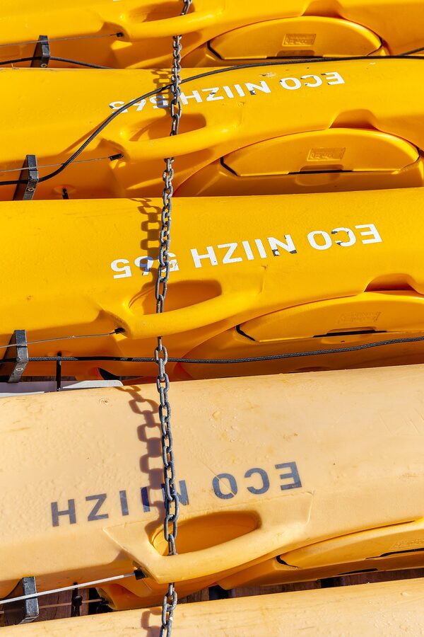 Yellow kayaks lined up at Akaroa for hire
