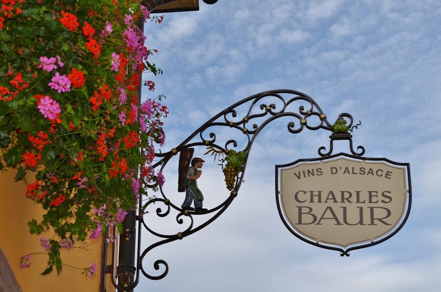 Alsace wine shop ornate sign with flowers