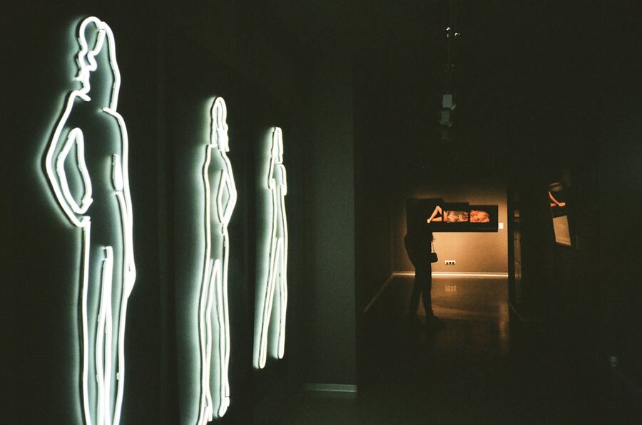 Neon silhouettes in modern art gallery setting