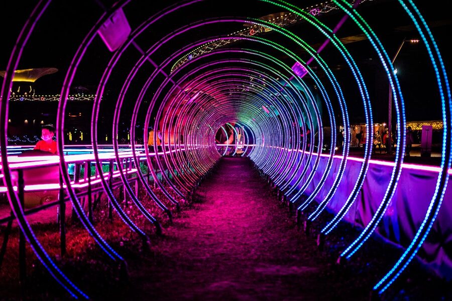Colorful neon light tunnel mesmerizing visual effect