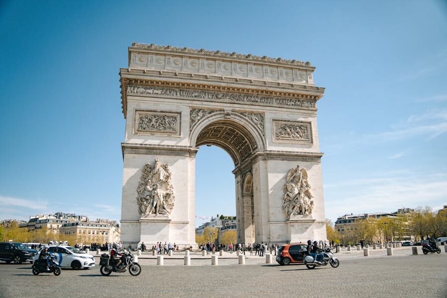 Arc de Triomphe Paris under a clear blue sky