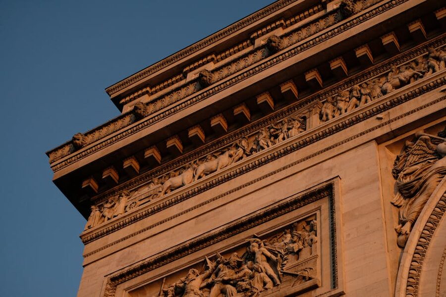 Detailed ornate carvings on the facade of the Arc de Triomphe
