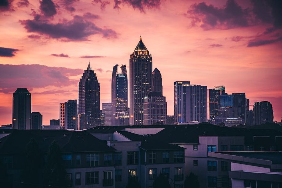 Atlanta skyline under pink sunset featuring high-rise buildings