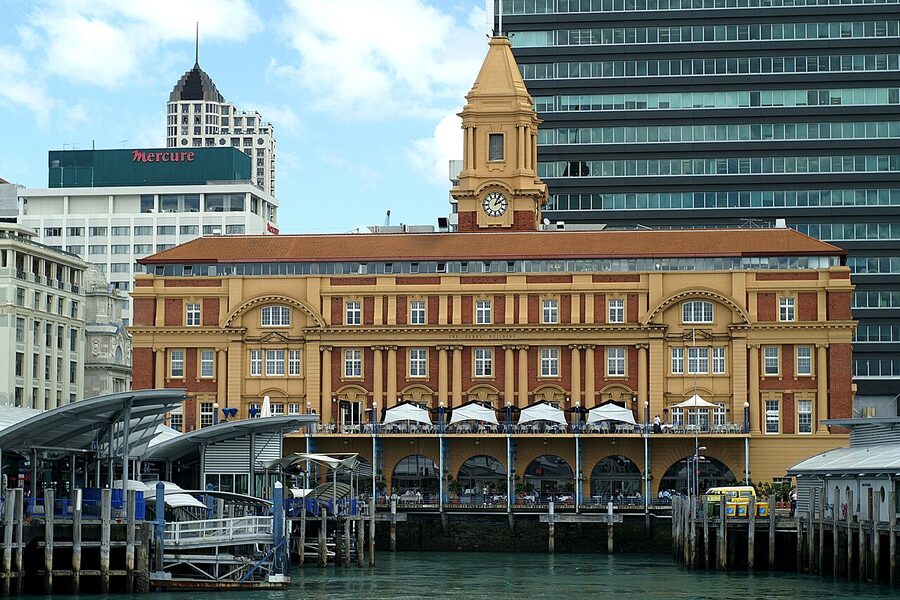 Auckland Ferry Terminal viewed from the harbour with Sky Tower