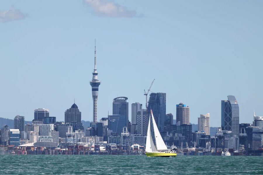 Sailboat in Auckland harbour with Sky Tower