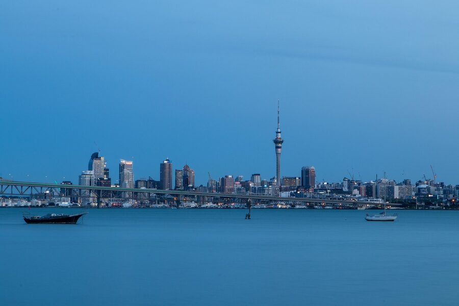 Auckland Sky Tower at sunset over the harbour