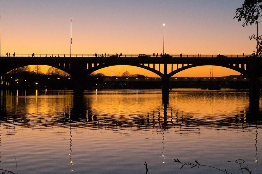Congress Avenue Bridge with bats at sunset Austin