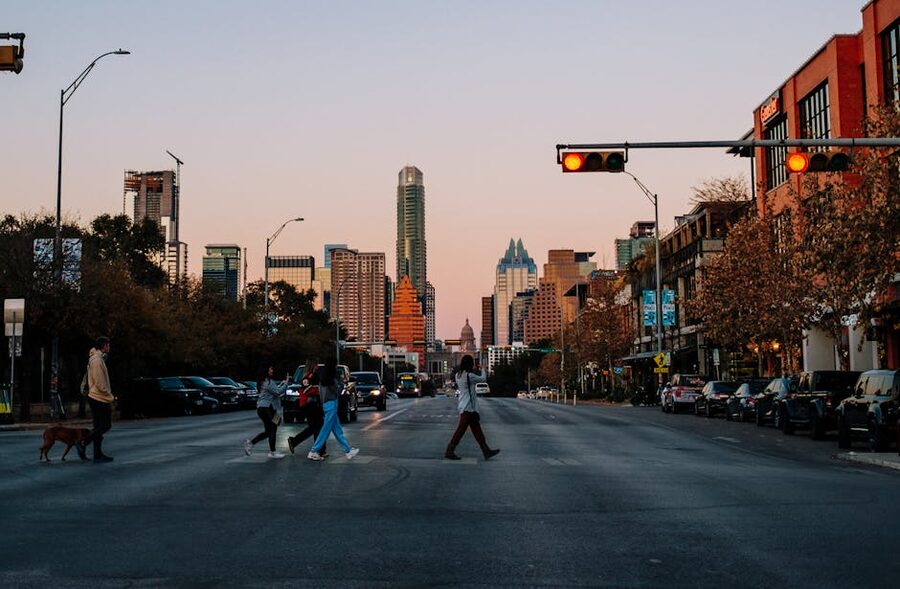 Downtown Austin crosswalk at sunset with skyline