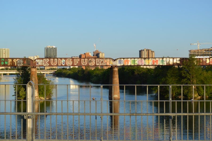 Colorful graffiti bridge over Lady Bird Lake Austin