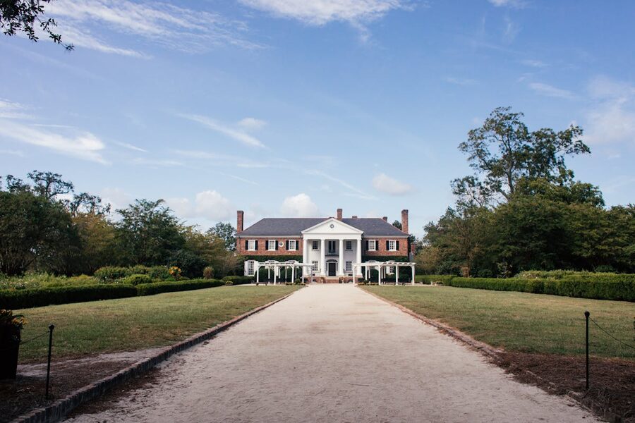 Historic Boone Hall Plantation mansion in South Carolina under blue sky