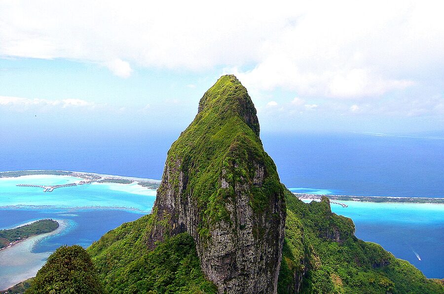 Mount Otemanu shrouded in cloud over Bora Bora lagoon