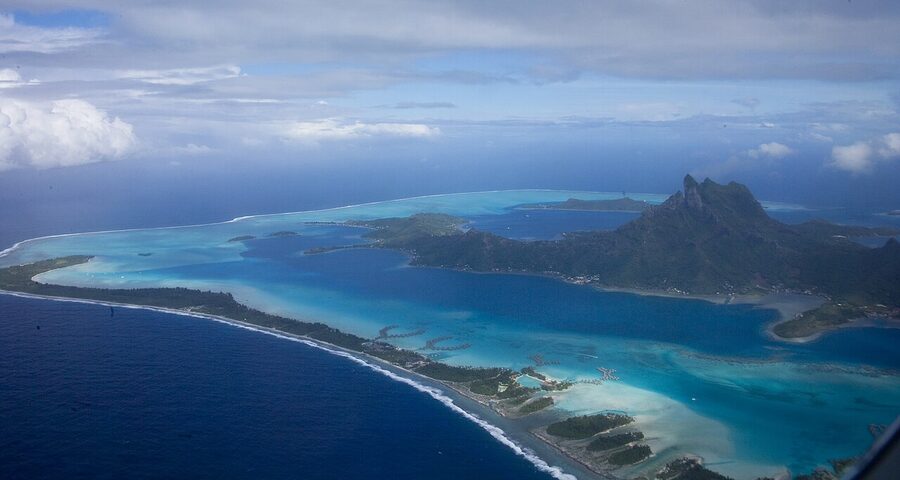 Overwater bungalows in the Bora Bora lagoon with Mount Otemanu