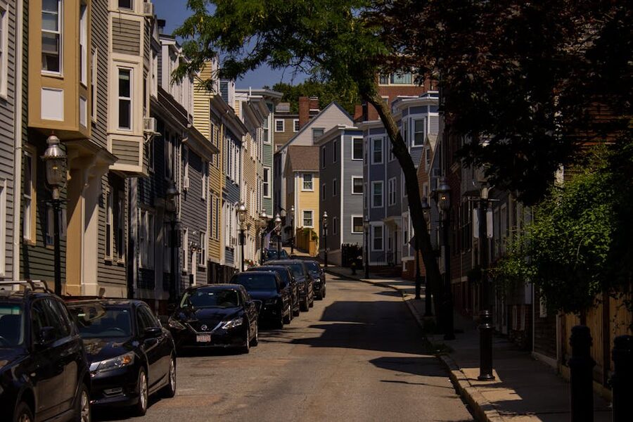 Back Bay brownstone row houses on a leafy Boston street