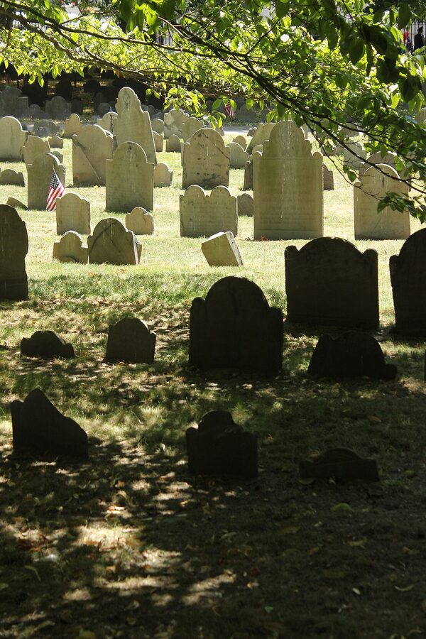 Close-up of weathered slate headstones at Granary Burying Ground, Boston