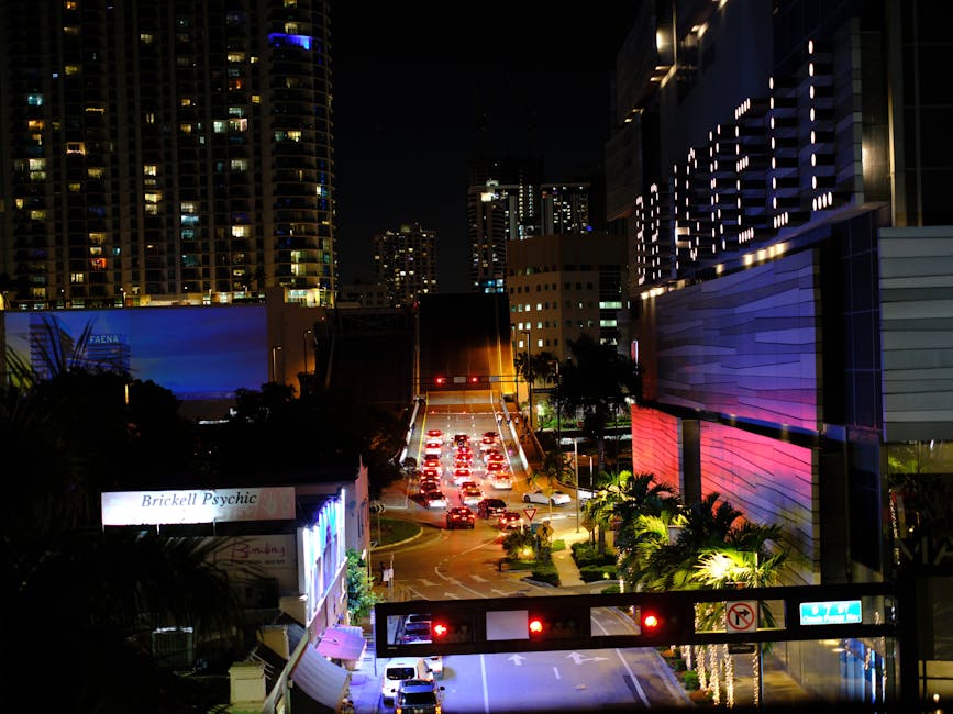 Busy Brickell street at night with Miami skyscrapers
