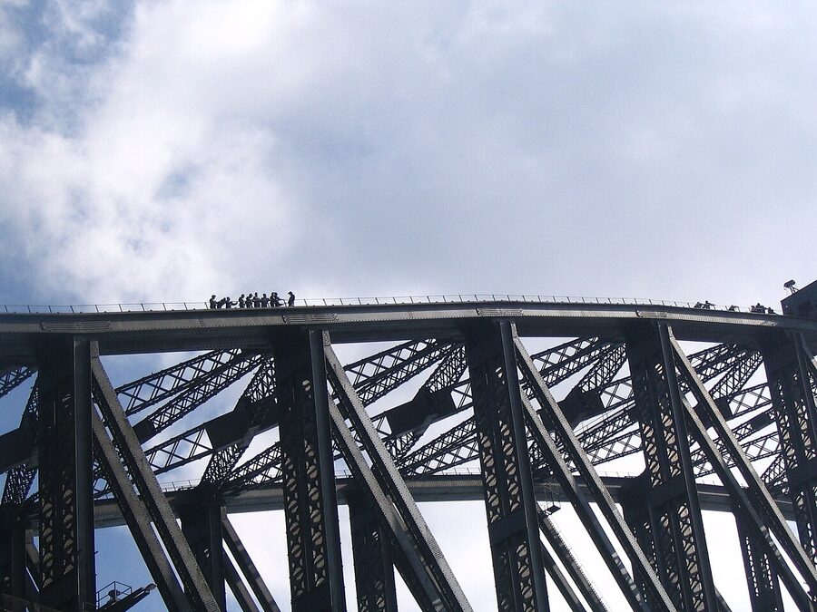 Group of climbers walking along the Sydney Harbour Bridge upper arch