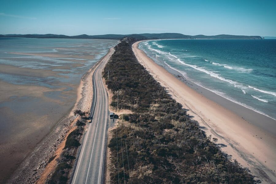 Aerial view of The Neck on Bruny Island with coastal road and beaches Tasmania