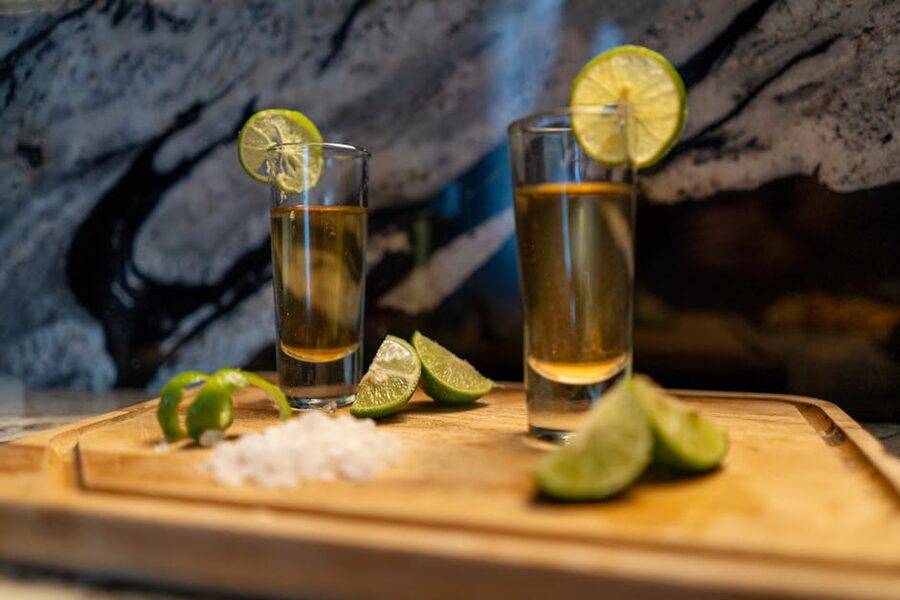 Tequila shots lined up on a wooden board