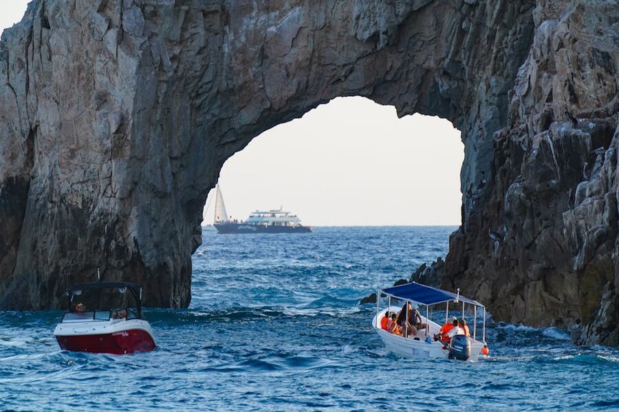 Arch of Cabo San Lucas with boats navigating the ocean