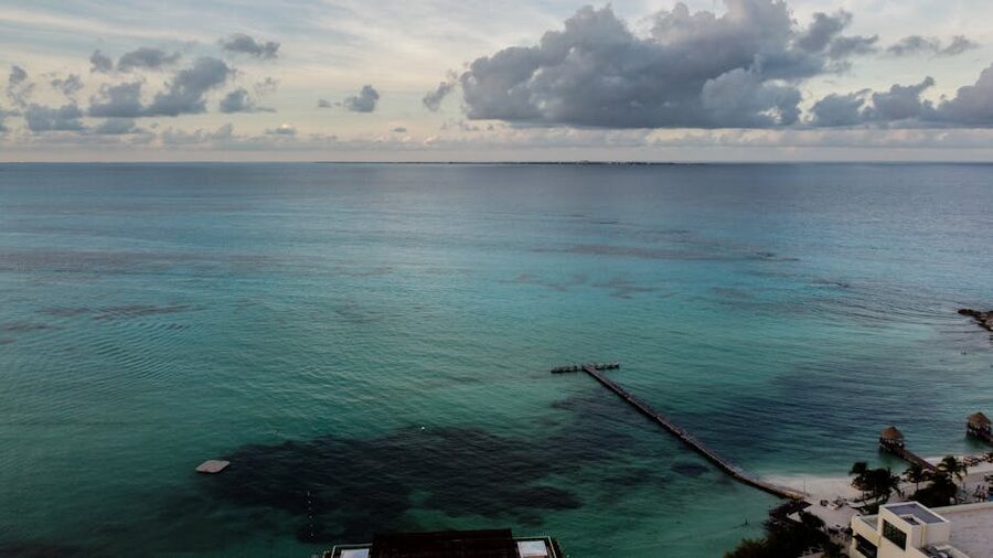 Drone view of a pier extending into Caribbean waters at Cancun Mexico