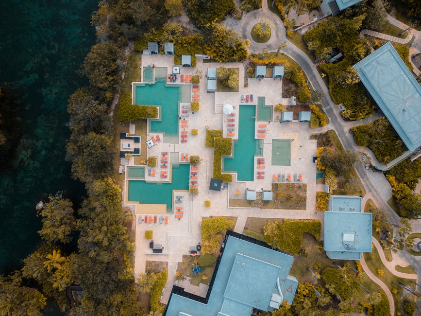 Aerial view of a luxury resort in Playa del Carmen with pools and tropical greenery
