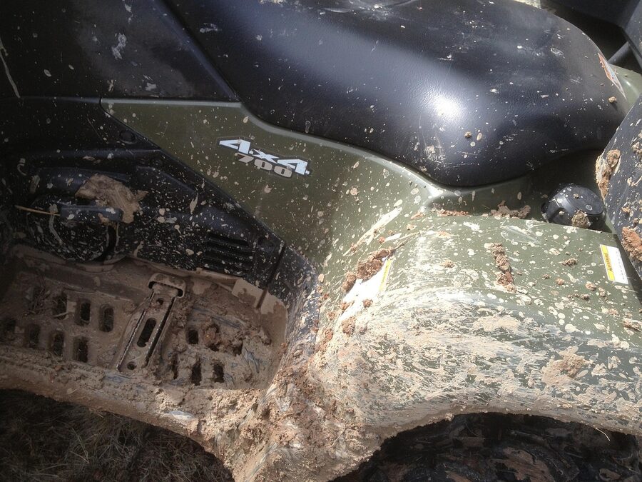 ATV on off-road muddy jungle trail