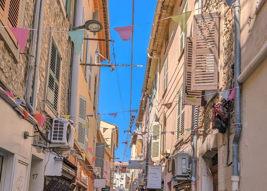 Antibes old town street with colorful bunting