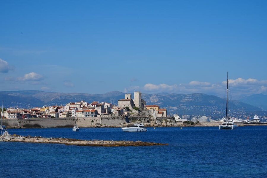 Antibes Old Town and marina under a clear blue sky