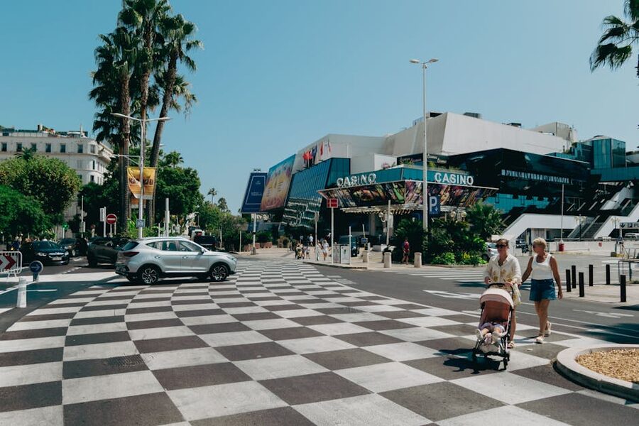Cannes promenade with casino and visitors