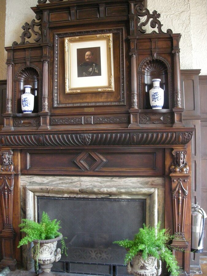 Great Hall fireplace at Casa Loma with carved stone mantel