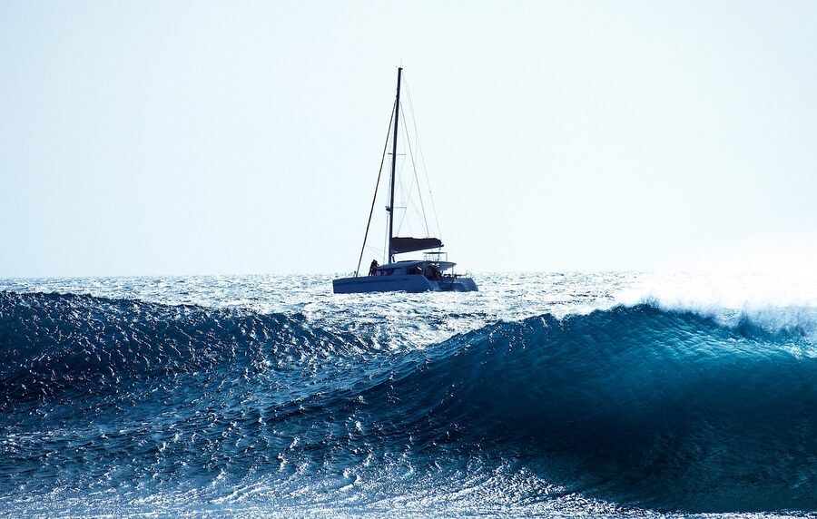 Catamaran cutting through Gulf waves
