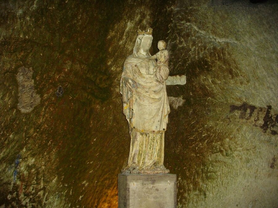 Champagne bottles aging in Pommery chalk cellar Reims