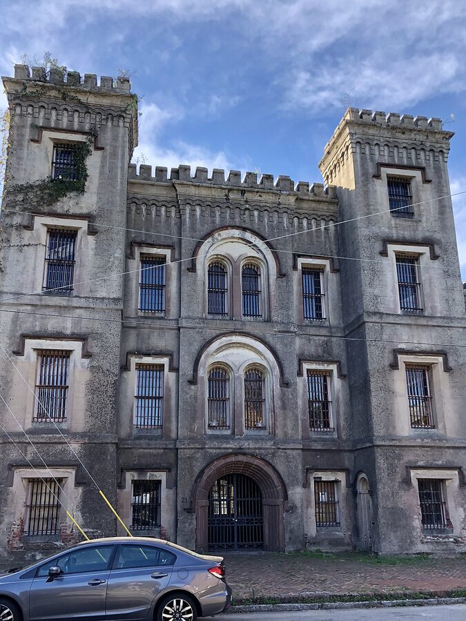 Old Charleston Jail weathered stucco facade on Magazine Street
