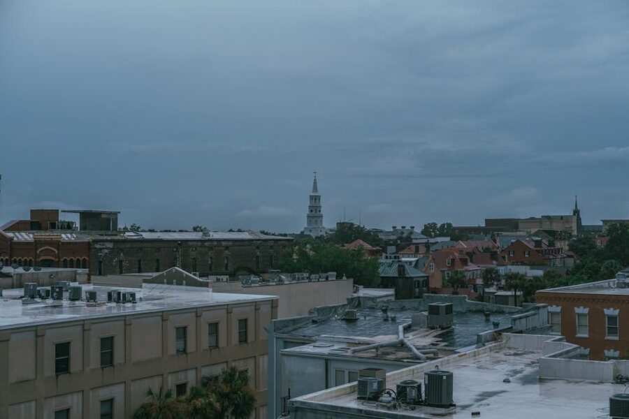 Charleston cityscape with St Michael's Church steeple under cloudy sky