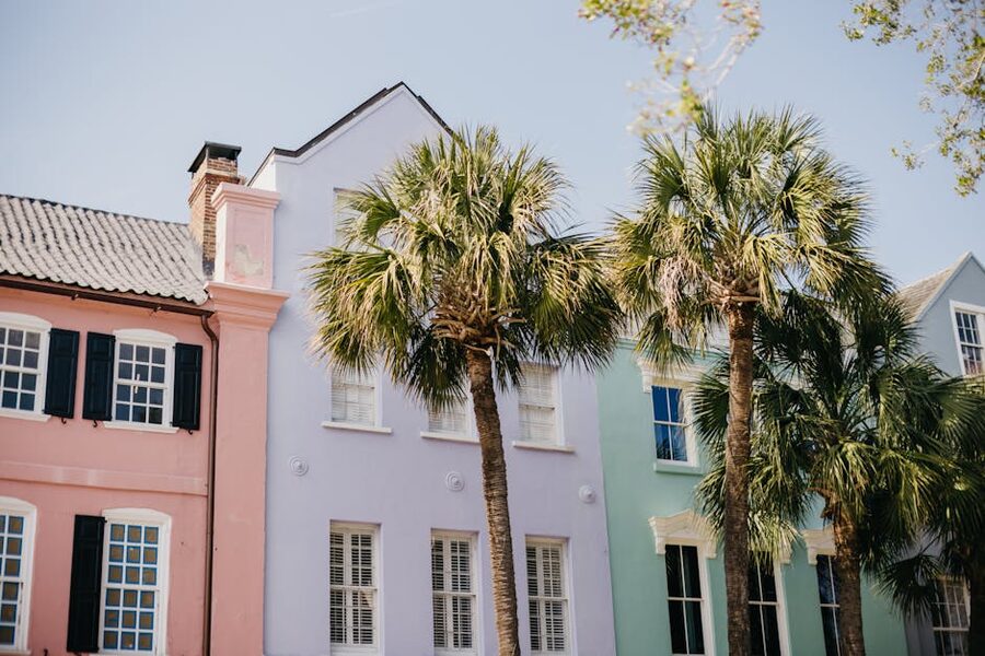 Pastel homes and palm trees on Rainbow Row, Charleston