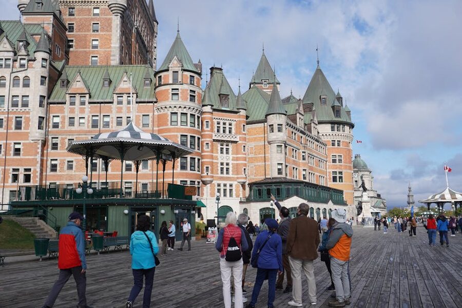 Visitors on Dufferin Terrace admiring Chateau Frontenac