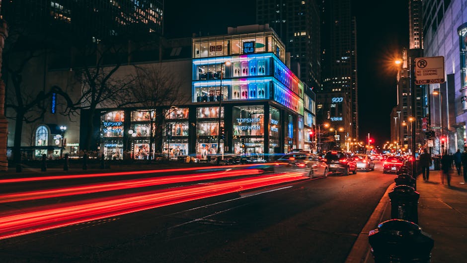 Chicago city street at night with light trails and illuminated buildings