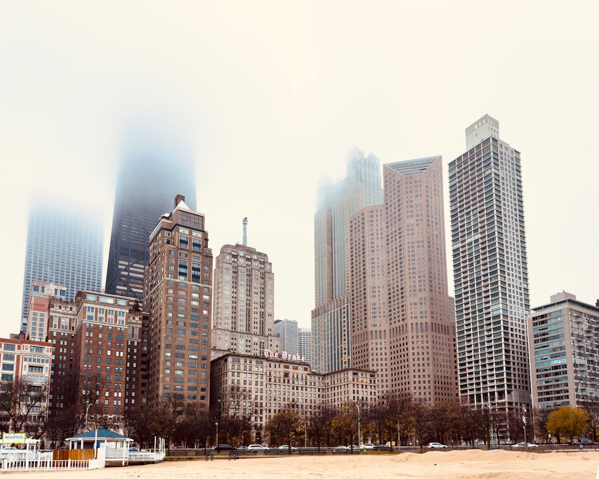 Foggy day in Chicago with vintage and modern skyscrapers looming through the mist
