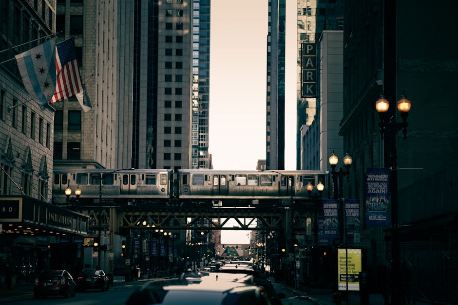 Chicago L train on a rail bridge between skyscrapers