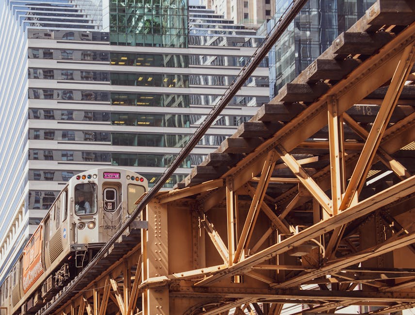 Chicago elevated train passing through downtown with modern skyscrapers