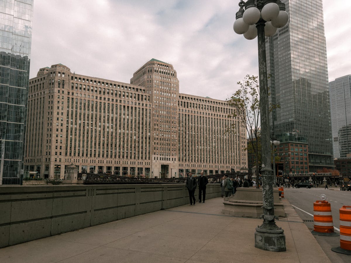 Chicago Merchandise Mart building with autumn foliage along the river