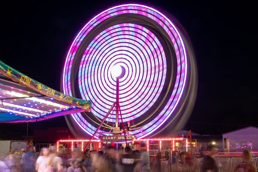 Ferris wheel spinning at night colorful